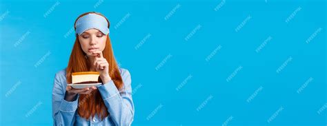 Free Photo Indecisive Redhead Girl Cant Resist Temptation Biting