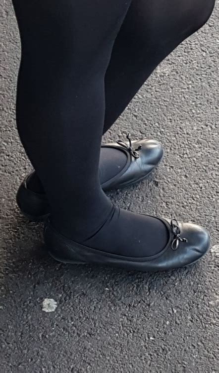 black opaque tights and black ballet flats with a tumbex