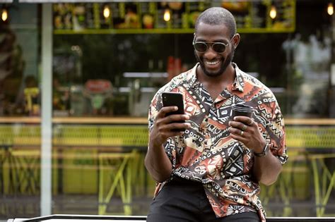 Free Photo Handsome Man With Sunglasses Using Smartphone Outdoors