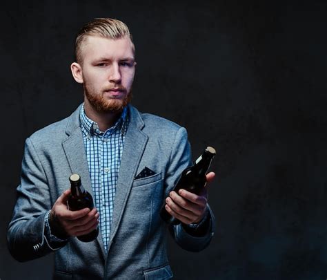Free Photo Stylish Redhead Bearded Male Dressed In A Suit Holds A