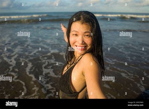 Beautiful Asian Woman Enjoying Sand And Sea Young Happy And