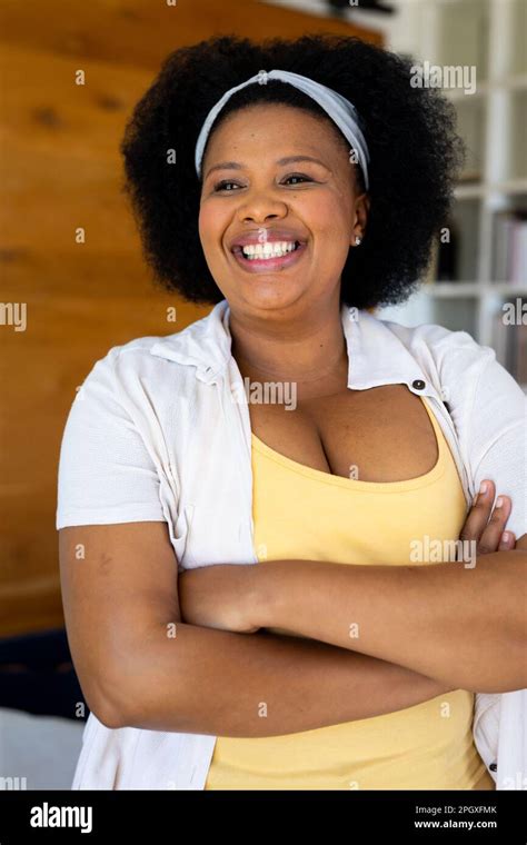 Happy Plus Size African American Woman Looking Away And Smiling