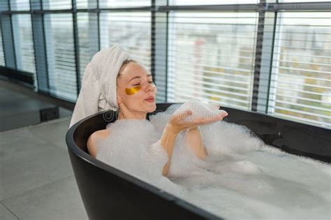 Spa Relaxation Young Woman Lying In Bath With Foam Bubbles Girl