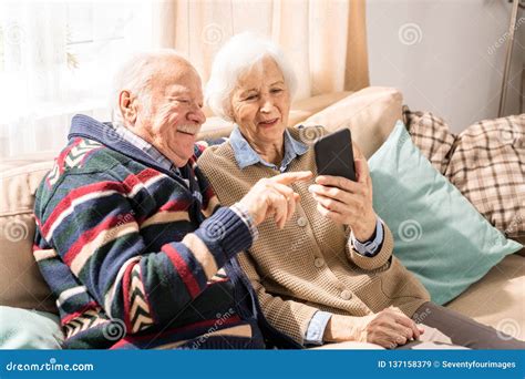 Senior Couple Using Smartphone Indoors Stock Image Image Of