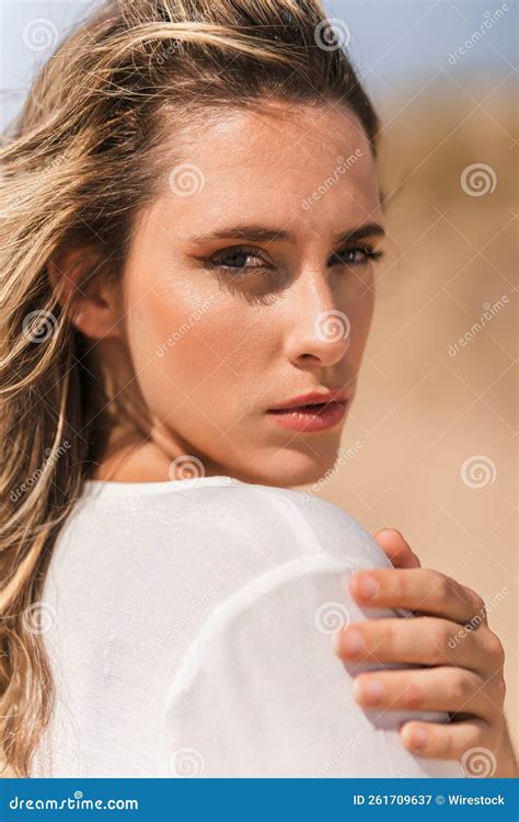Vertical Shot Of A Young And Beautiful Spanish Woman In A Bikini And