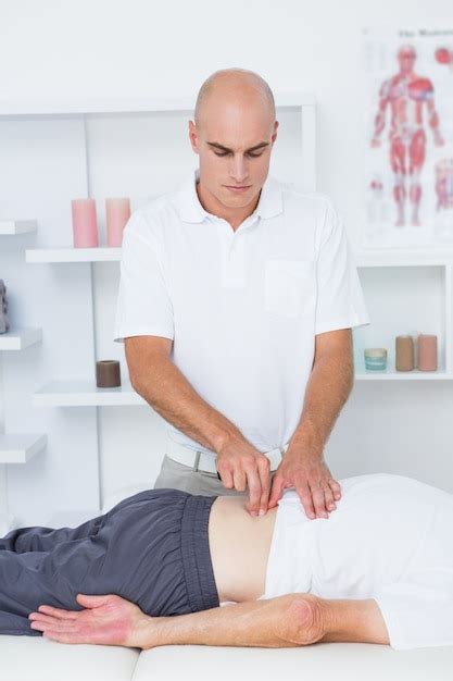 Premium Photo Physiotherapist Doing Back Massage To His Patient