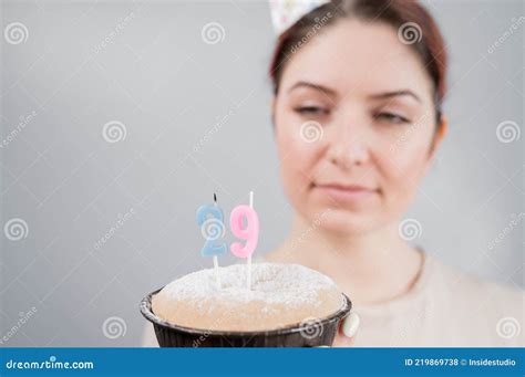 The Happy Woman Makes A Wish And Blows Out The Candles On The 29th