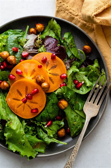 Persimmon Pomegranate Salad With Candied Hazelnuts Garlic And Zest