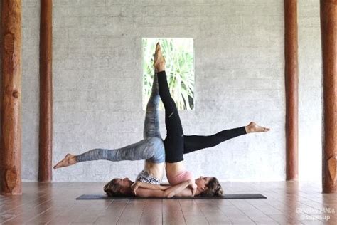 Two Women Are Doing Yoga On Their Stomachs