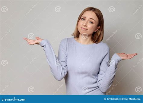 Portrait Of Shy Awkward Young Woman Feeling Embarrassed Confused And