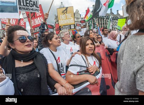 Refugees Carry The Refugees Welcome Here Banner At The Front Of The