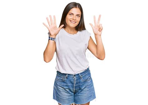 Young Caucasian Woman Wearing Casual White Tshirt Showing And Pointing