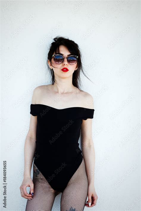 Sexy Girl Or Female Sex In A Sexy Body Suit Is Seductive In Sunglasses