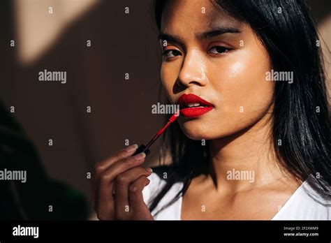 Portrait Of Crop Thoughtful Ethnic Female With Long Dark Hair Looking
