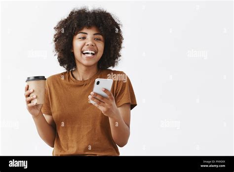 Waist Up Shot Of Trendy Carefree African American Girl With Curly Hair
