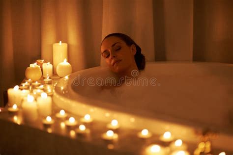 Sublime Ambient Relaxation A Gorgeous Woman Relaxing In A Candle Lit