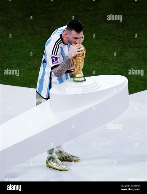 Argentinas Lionel Messi Kisses The World Cup Trophy After The Fifa