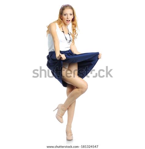 Zdjęcie Stockowe „surprised Girl Lifts Her Skirt” 181324547