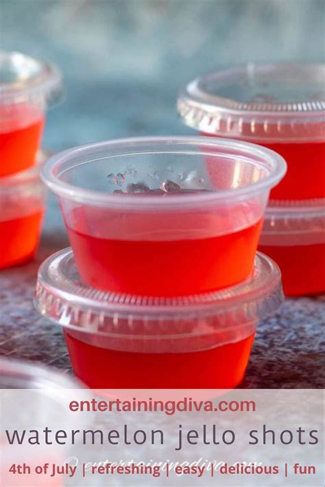 Plastic Cups Filled With Watermelon Jello Shots Are Sitting On A Table Top