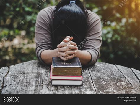 Woman Praying Bible