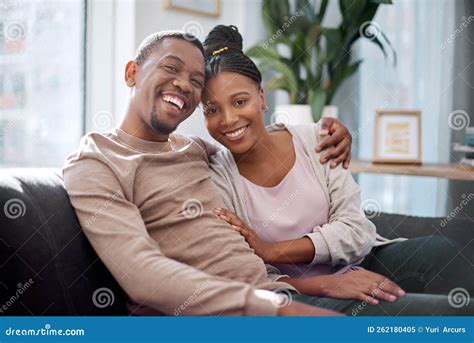 Black Couple Hug And Portrait Smile On Sofa In Relax For Relationship
