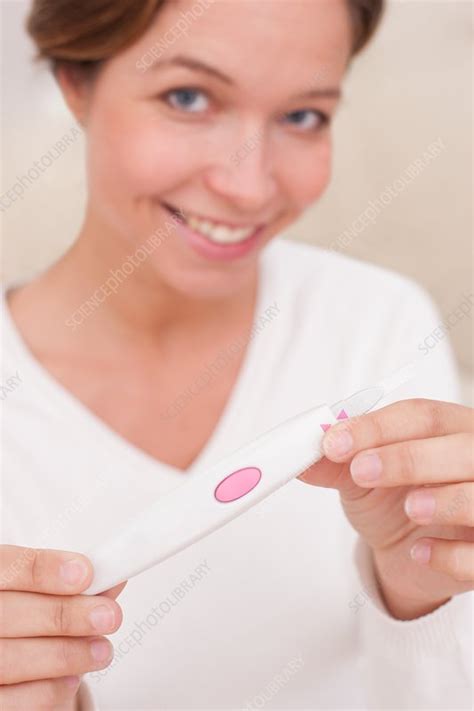 Woman Holding Positive Pregnancy Test Stock Image F018 4854