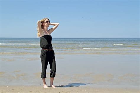 Beautiful Blonde Woman Relaxing At The Beach In Netherlands Stock Image