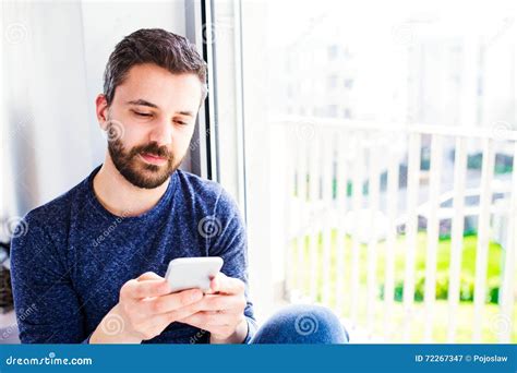 Hipster Businessman Working From Home Holding Smartphone Texti Stock