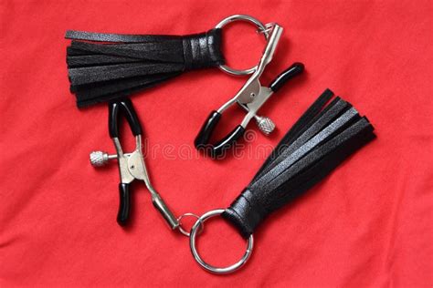 Nipple Clamps In Red Background Bdsm Outfit Accessories For Adult Sex