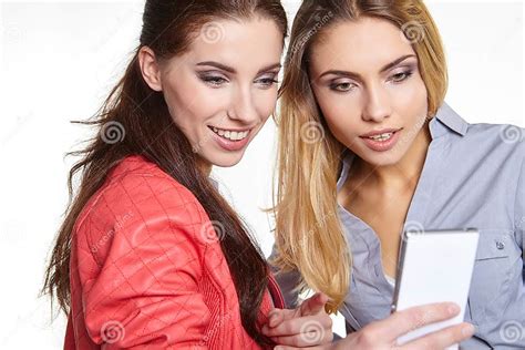 Two Women Sharing Social Media In A Smart Phone Stock Image Image Of