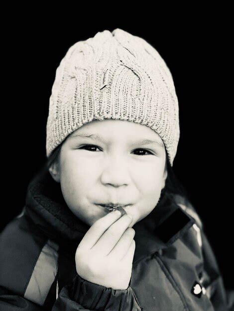 Premium Photo Close Up Portrait Of Cute Girl Against Black Background