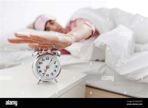 Alarm Clock Ringing Woman Waking Up In Early Morning For Work