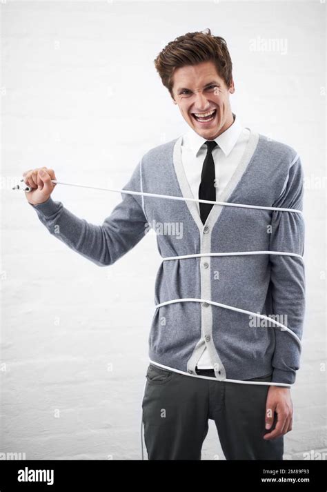The Cable Guy A Young Nerdy Guy With A Cable Wrapped Around Him Stock