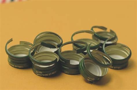 Several Green Glasses Sitting On Top Of A Yellow Table Next To Each