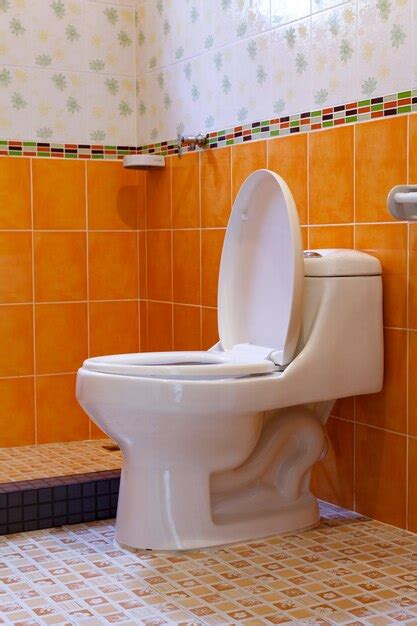 Premium Photo Toilet Bowl In A Bathroom