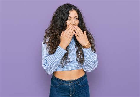 Young Hispanic Girl Wearing Casual Clothes Laughing And Embarrassed