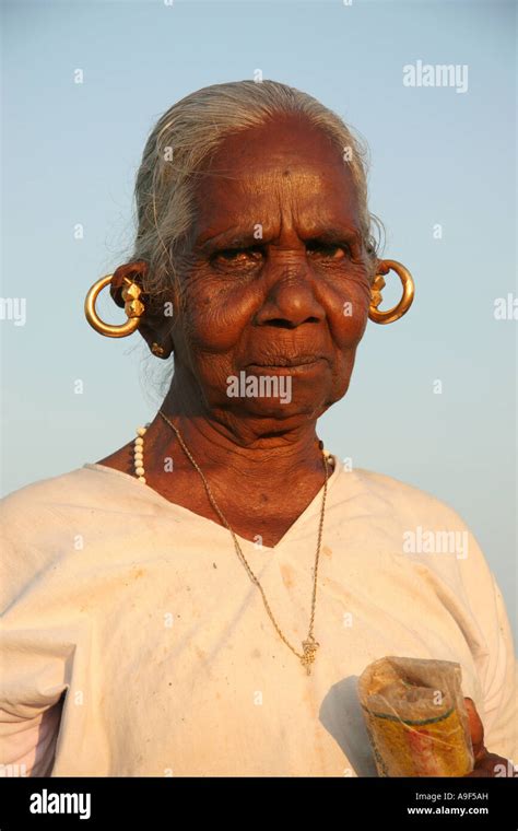 Old Woman Poses For Her Portrait To Be Taken In A Backwater Village