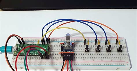 volume and media control buttons with raspberry pi pico · one transistor