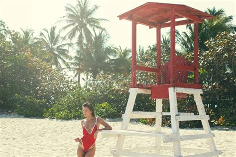 Woman In Red Swimsuit Beside Lifeguard Tower Stock Image Image Of