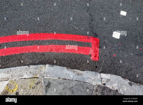 A Double Red Line Signifying A Tfl Transport For London No Stopping