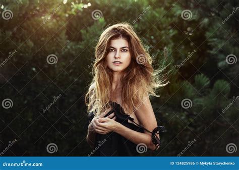 Gorgeous Woman With Natural Beauty In Forest With Windy Long Healthy