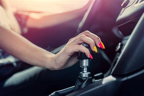 Female Driver Hand Shifting Gear Shift Knob Manually Before The