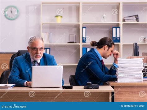 Old Male Boss And His Young Male Assistant In Bullying Concept Stock