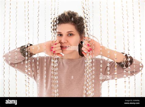 Smiling Beautiful Brunette Woman With Piercing In Nose Looking At