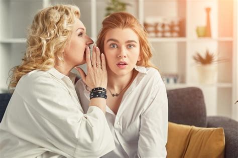 Premium Photo Mother Gossiping With Shocked Daughter