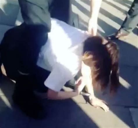 shock video of schoolgirl being dragged along ground by policeman