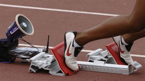why are track starting blocks designed to begin from the crouching