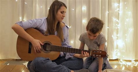 Mother And Son Spending Time With A Guitar Free Stock Video Footage