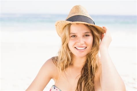 Premium Photo Portrait Of Pretty Woman In Bikini And Hat Sitting On