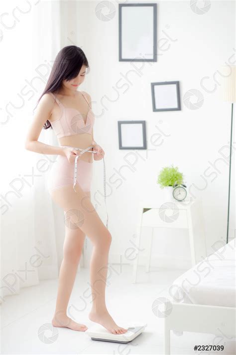 Beautiful Young Asian Woman Sexy Body Slim Standing On Scales Stock